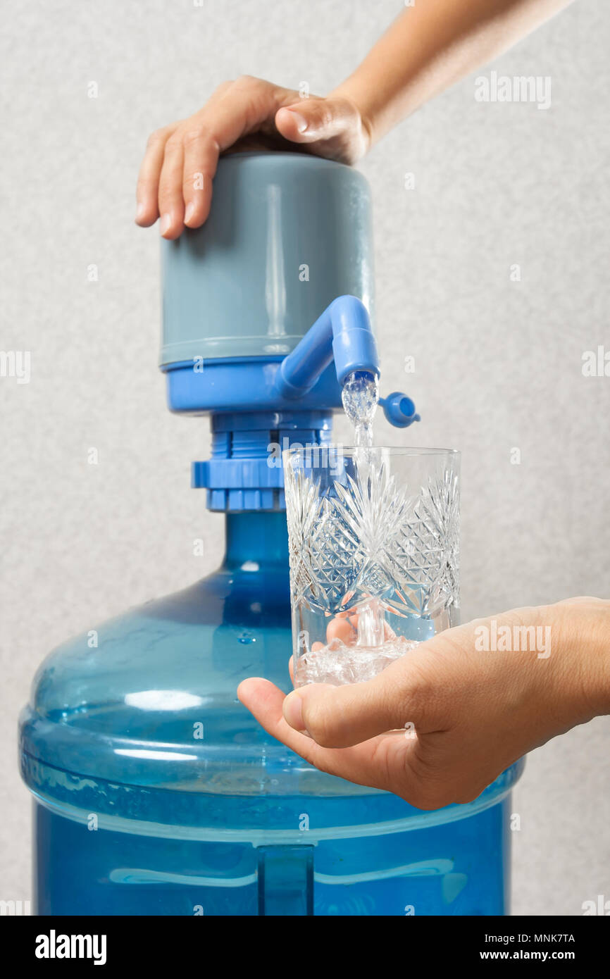 Hand pouring water from bottle hi-res stock photography and images - Alamy