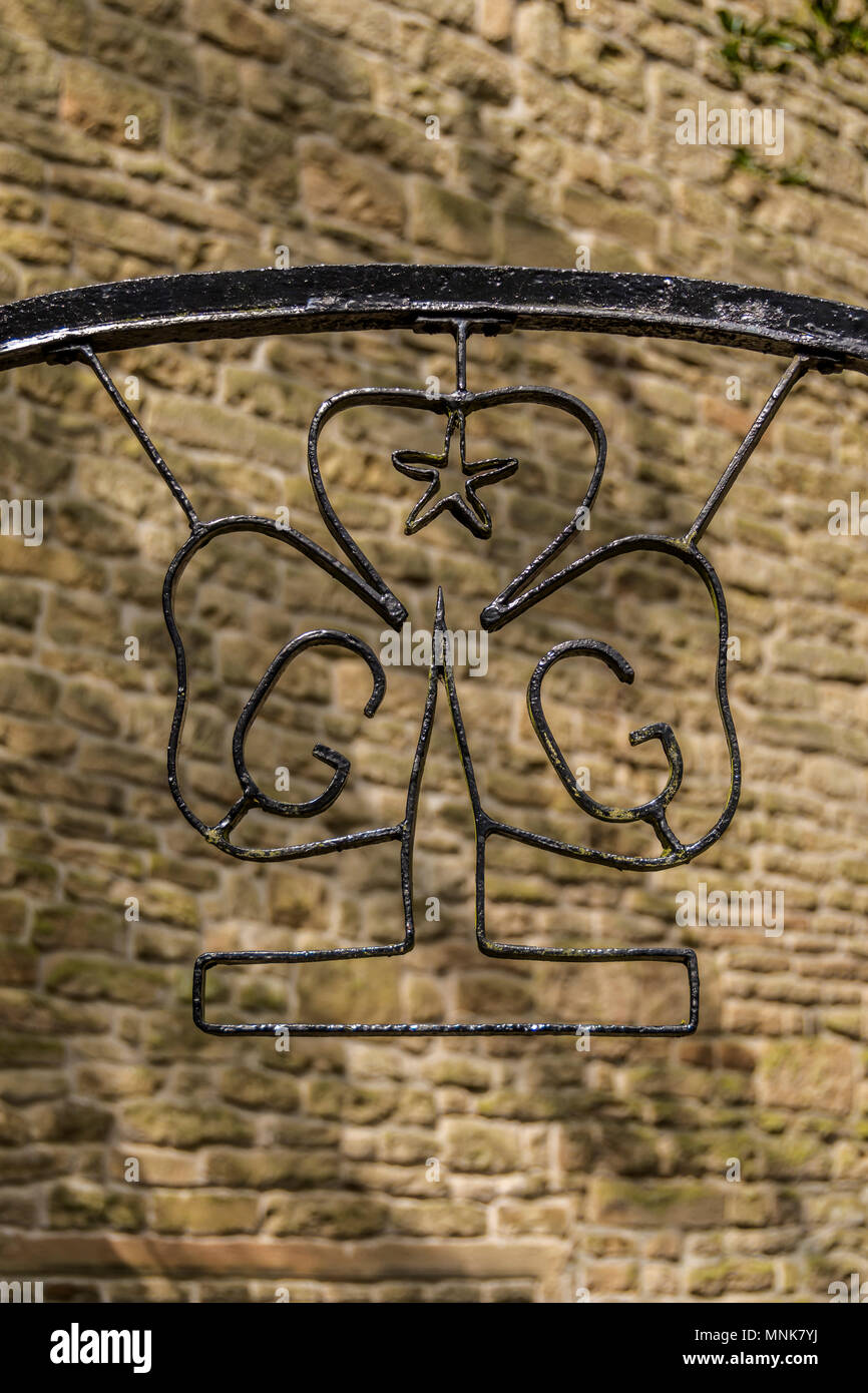 Wrought iron work. Sign over a gate from Victorian times Stock Photo ...