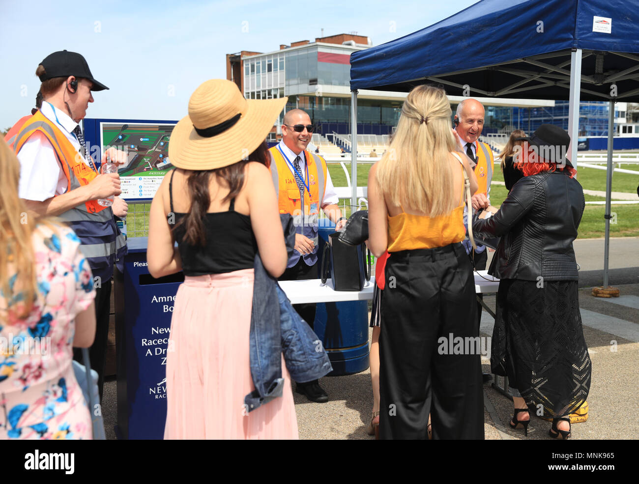 Security check the personal items of racegoers at Newbury Racecourse ...