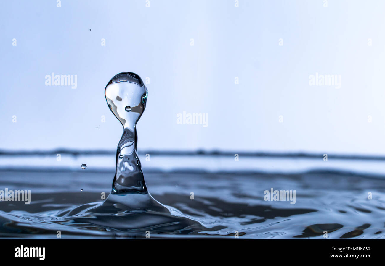 water drop splashing on the surface Stock Photo - Alamy