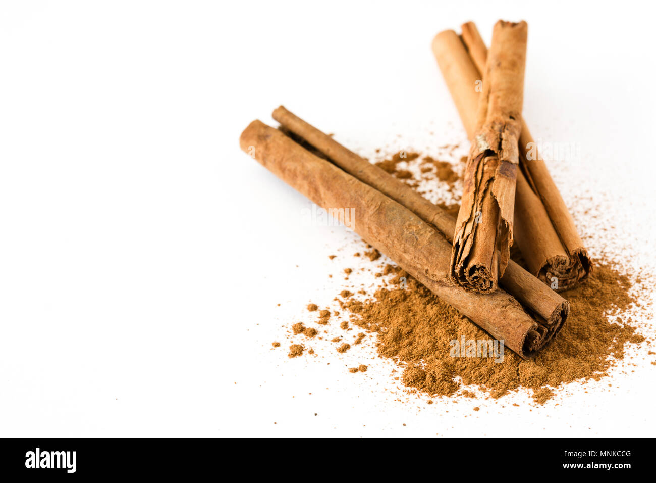 Cinnamon sticks and powder isolated on white background Stock Photo - Alamy