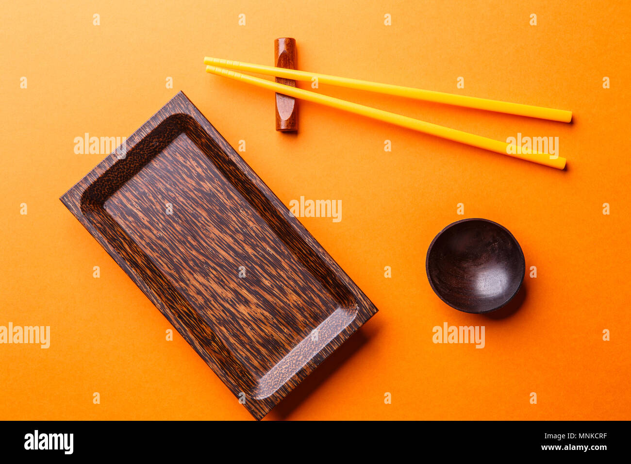 Sticks, plate on empty background Stock Photo - Alamy