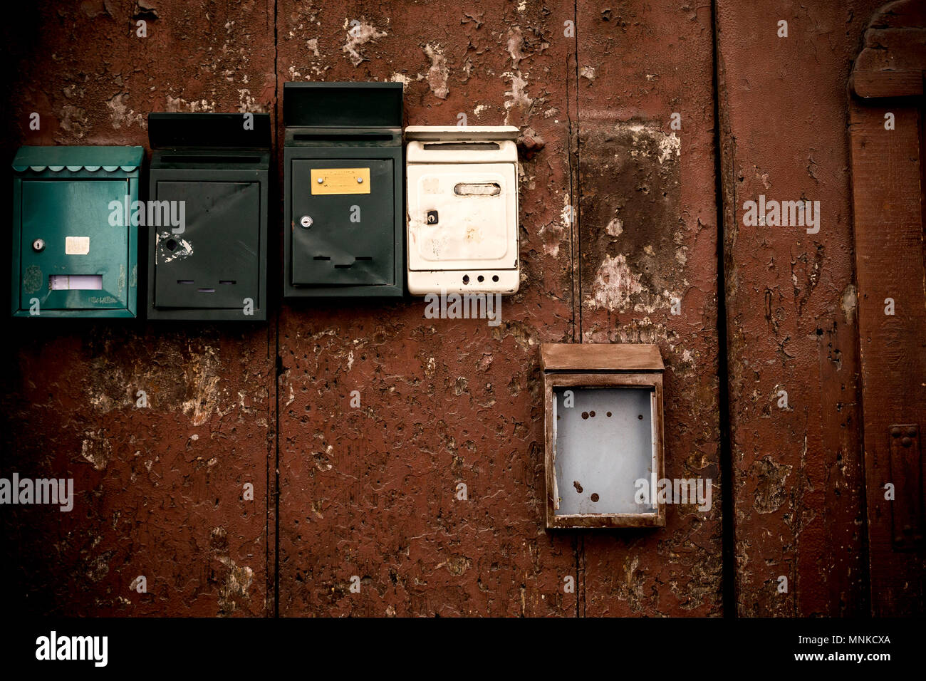 Post boxes on gate Stock Photo - Alamy