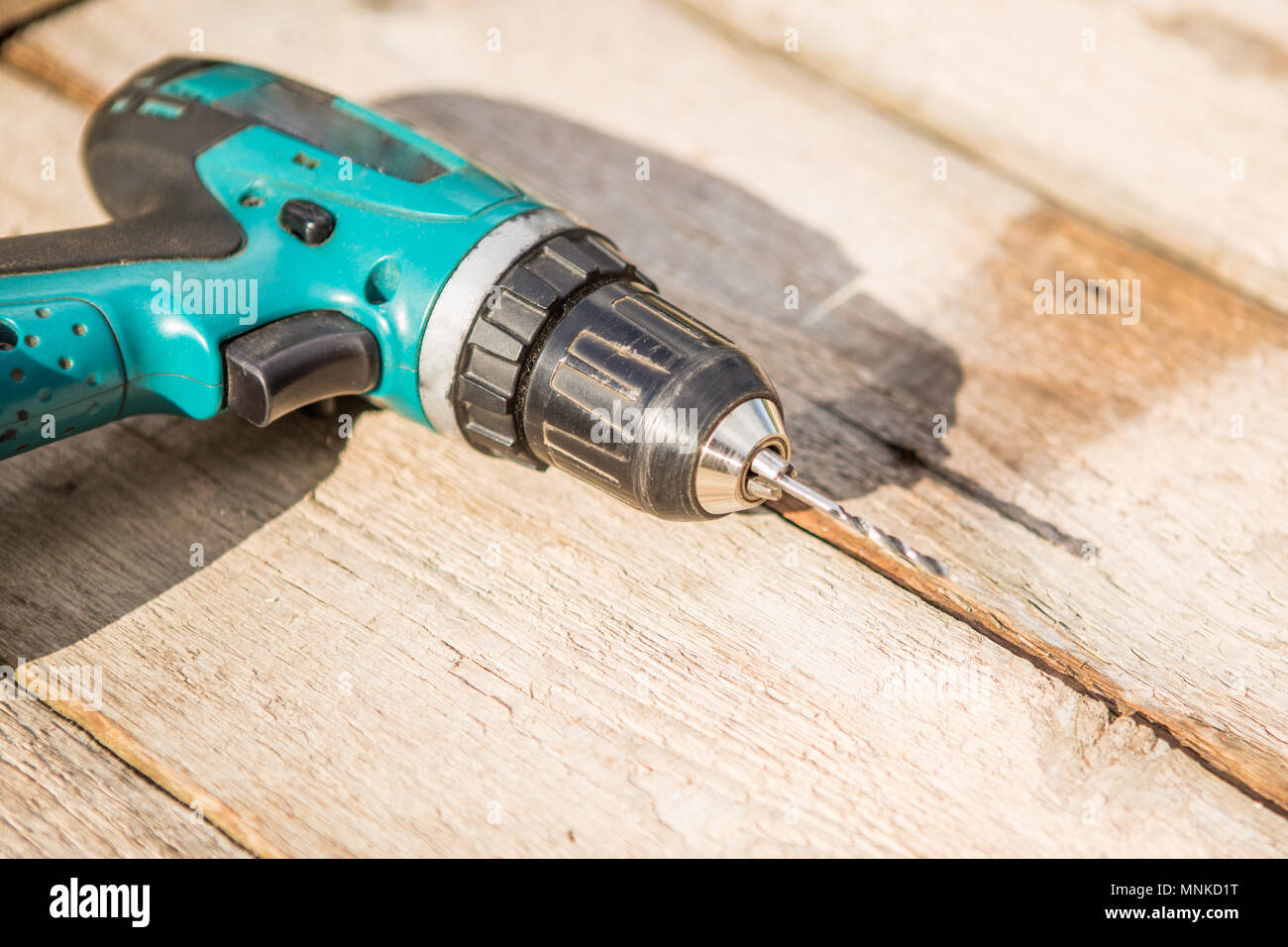 Man working with an electric screwdriver Stock Photo - Alamy