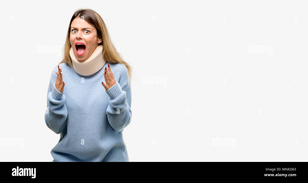 Young injured woman wearing neck brace collar stressful keeping hands ...