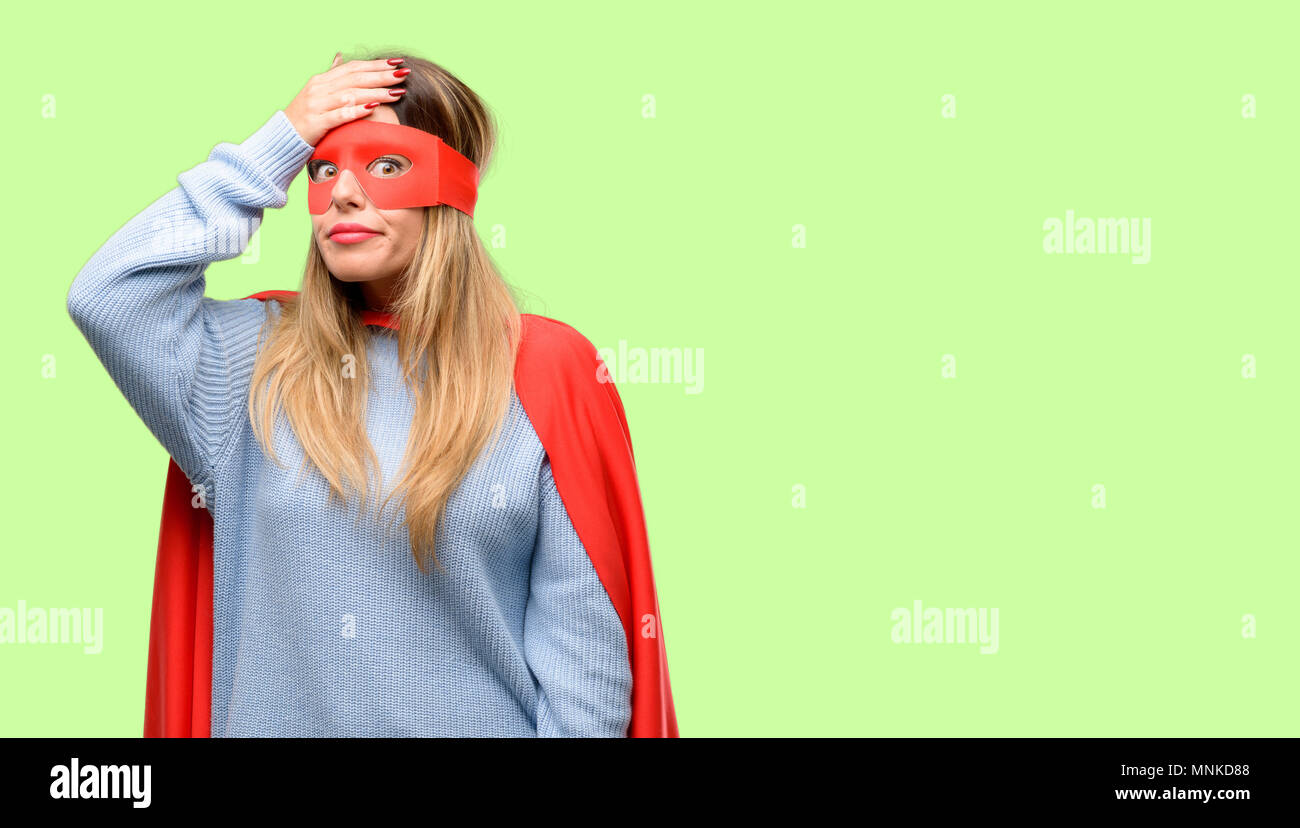 Young super woman terrified and nervous expressing anxiety and panic ...