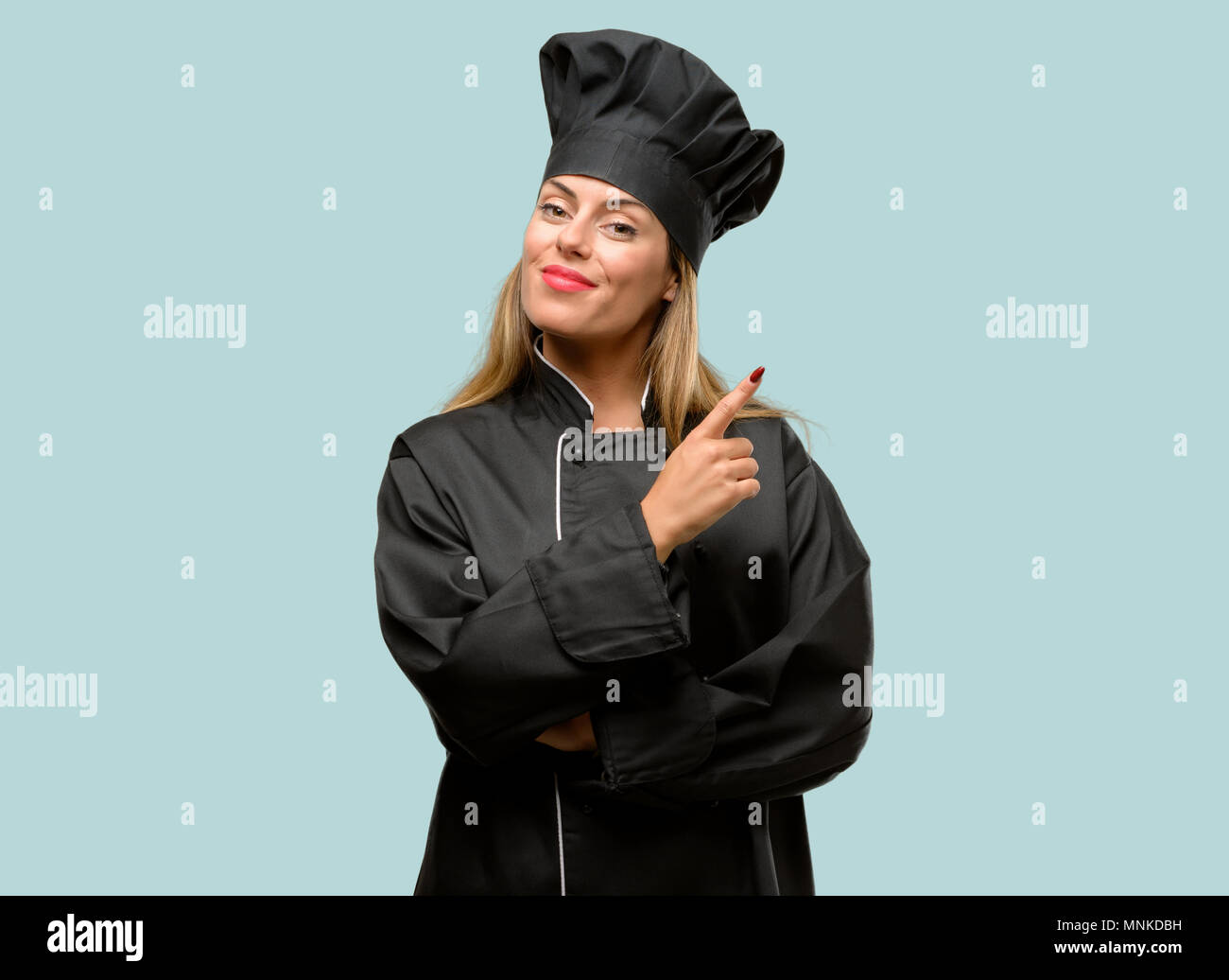 Standing pointing smiling uniform hat hi-res stock photography and ...