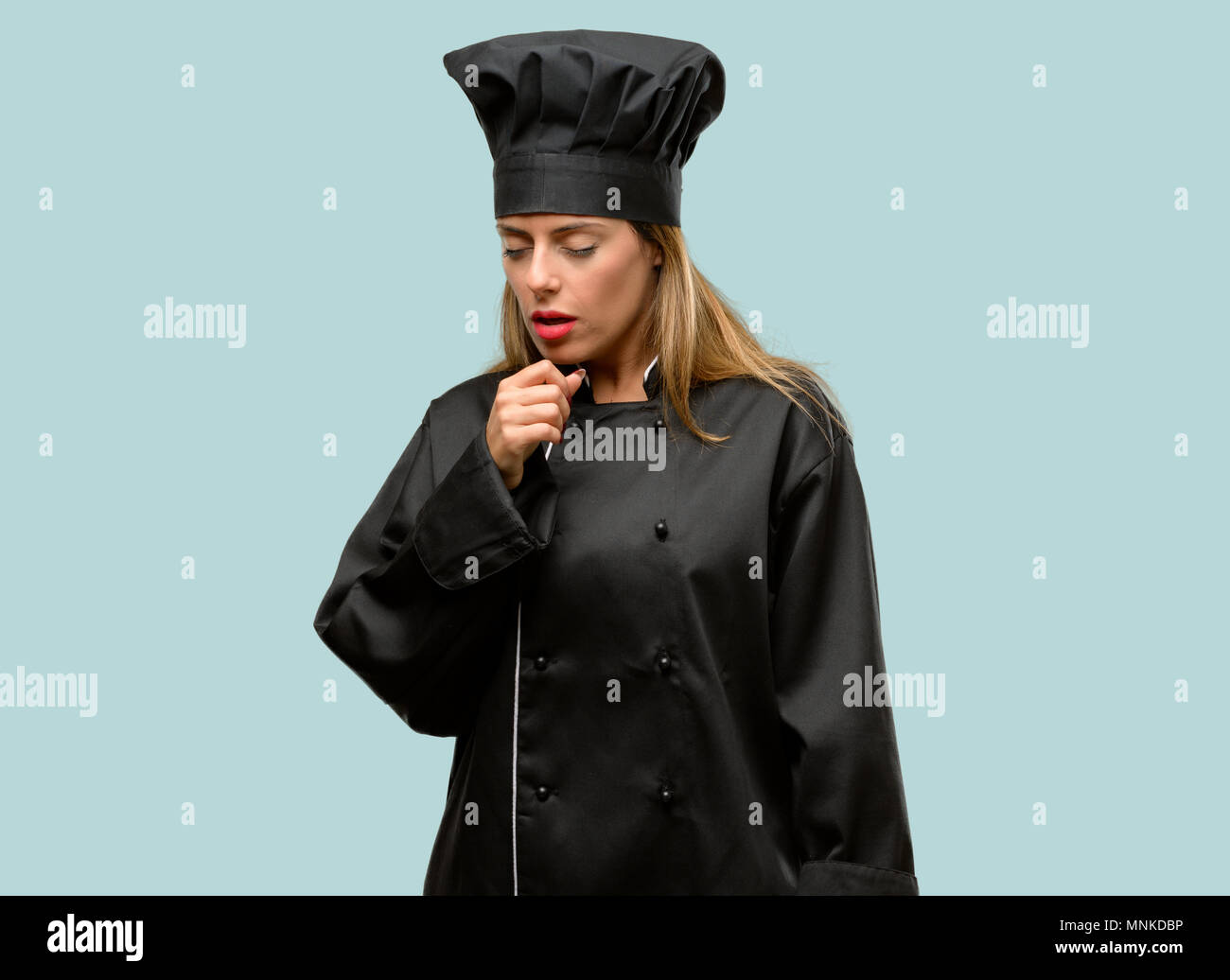 Young cook woman sick and coughing, suffering asthma or bronchitis ...
