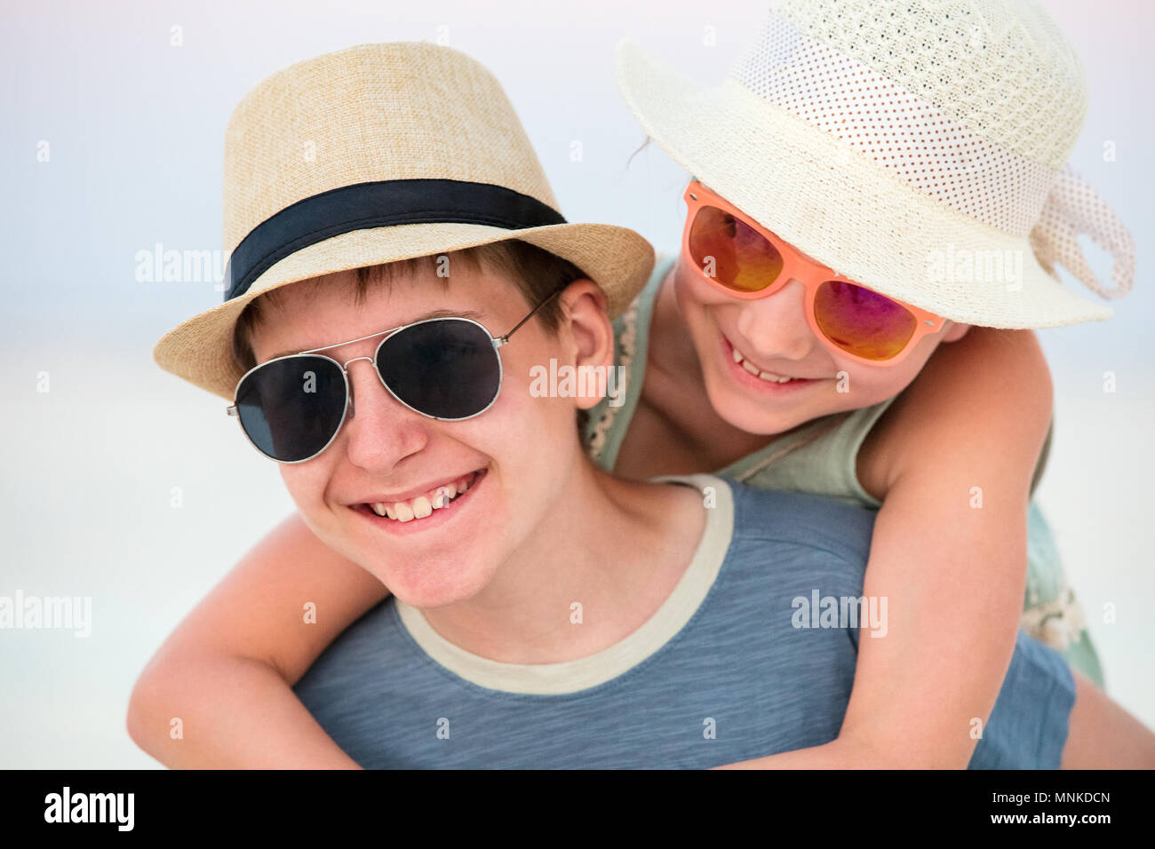 Portrait of kids having fun during tropical summer vacation playing ...