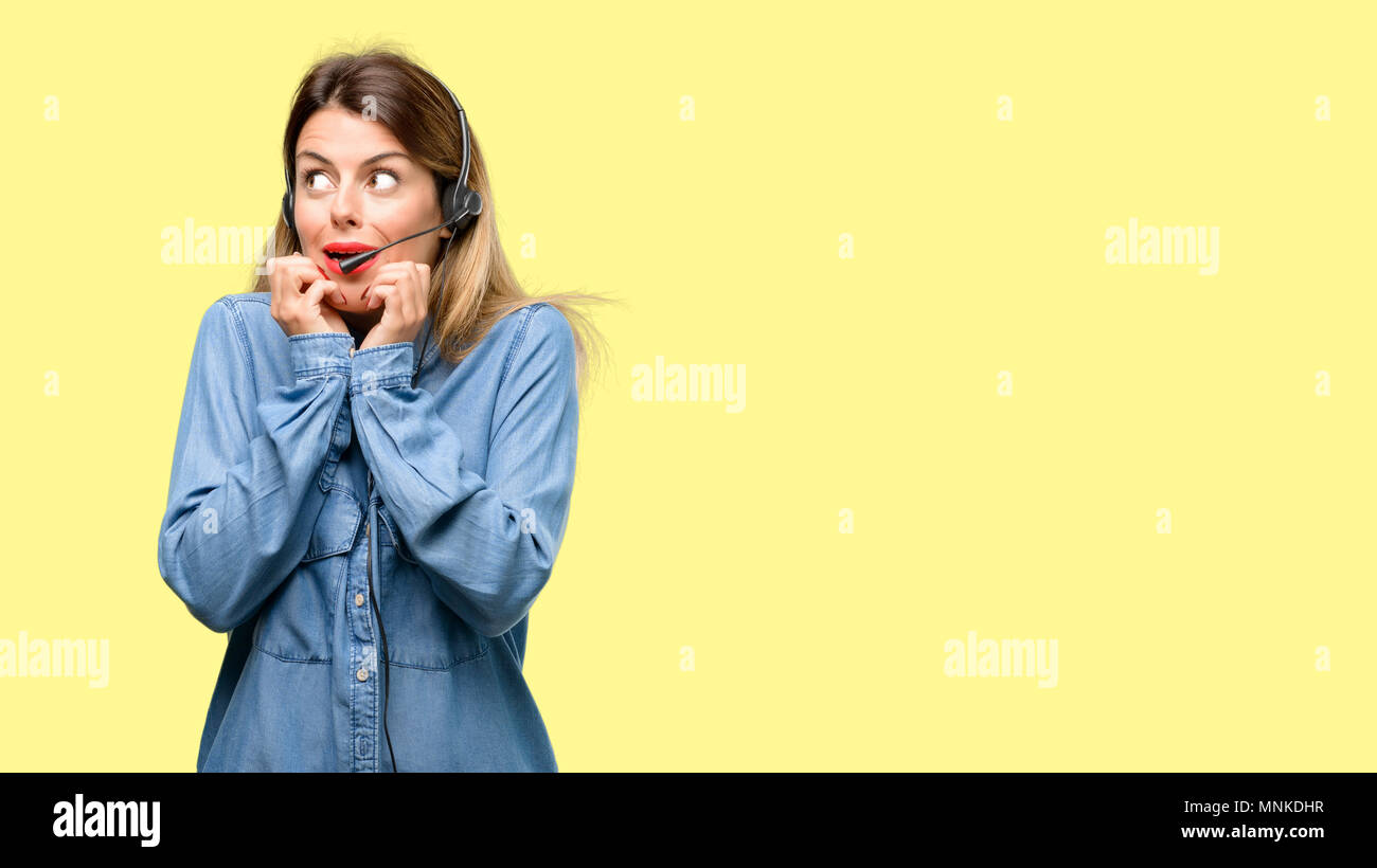 Consultant of call center woman in headphones terrified and nervous ...