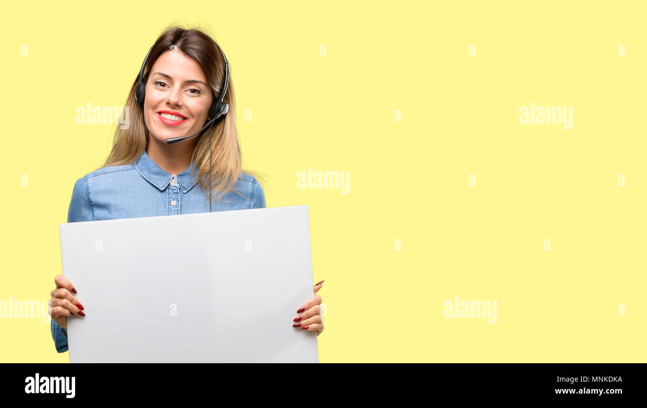 Consultant of call center woman in headphones holding blank advertising ...