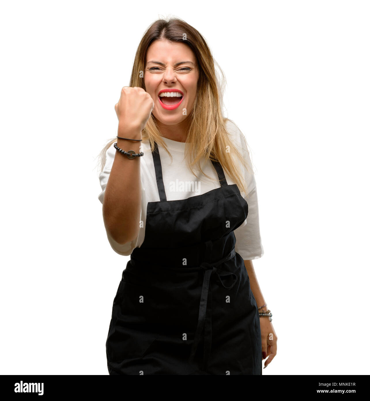 Shop owner woman wearing apron irritated and angry expressing negative ...