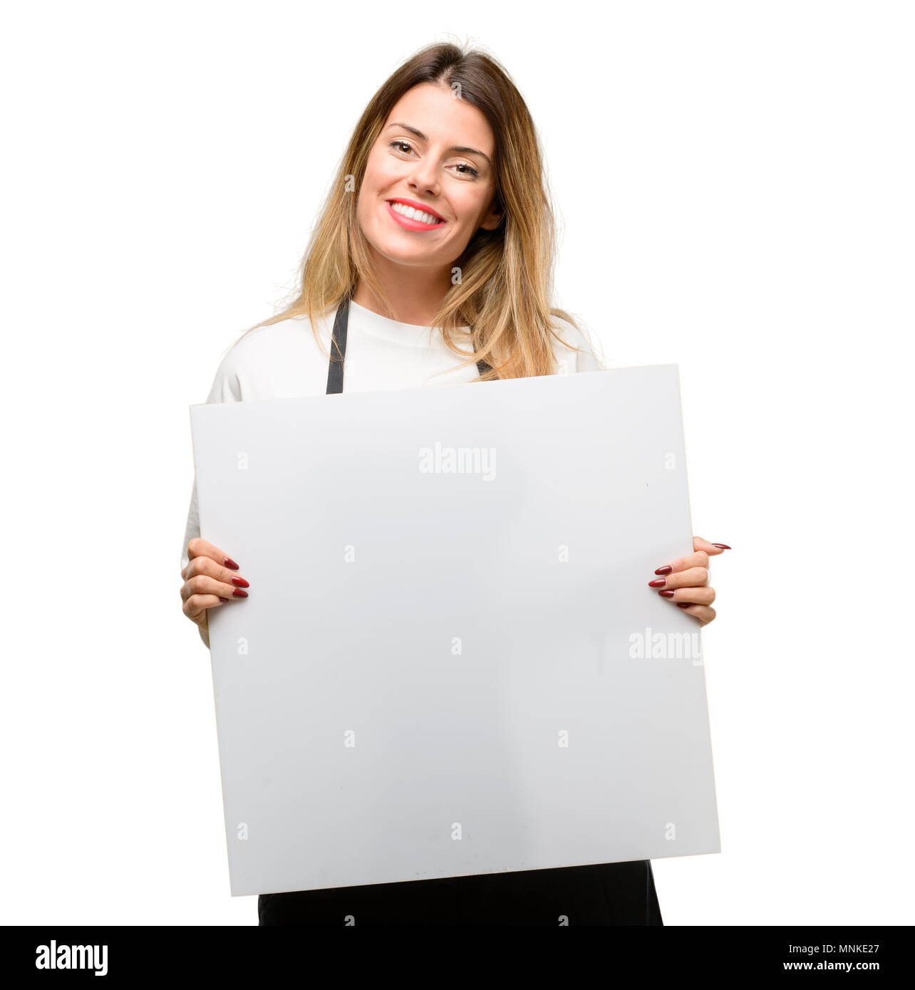 Shop owner woman wearing apron holding blank advertising banner, good ...