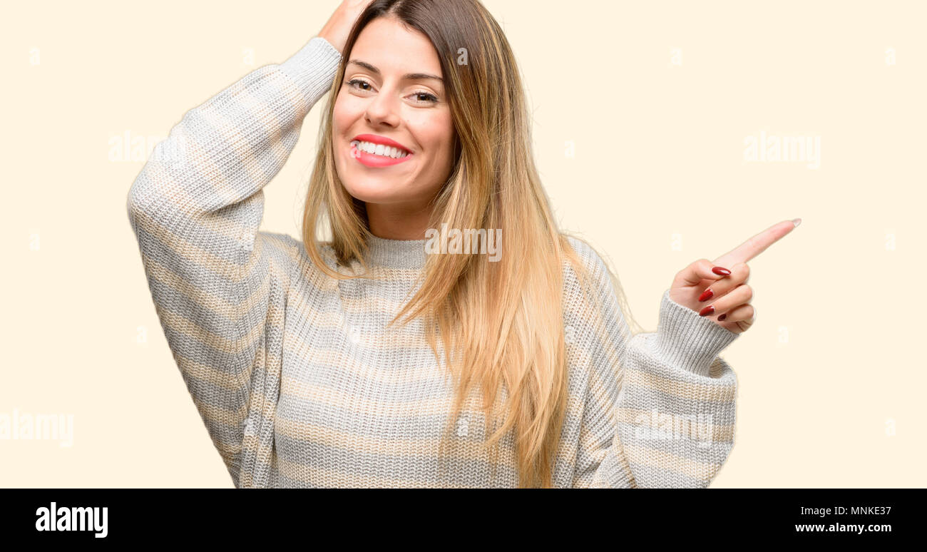 Young beautiful woman pointing away side with finger Stock Photo - Alamy