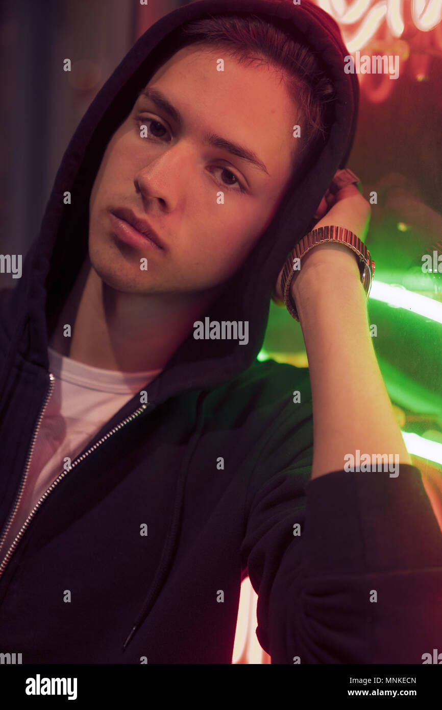 Young man night portrait, lit by neon Stock Photo - Alamy