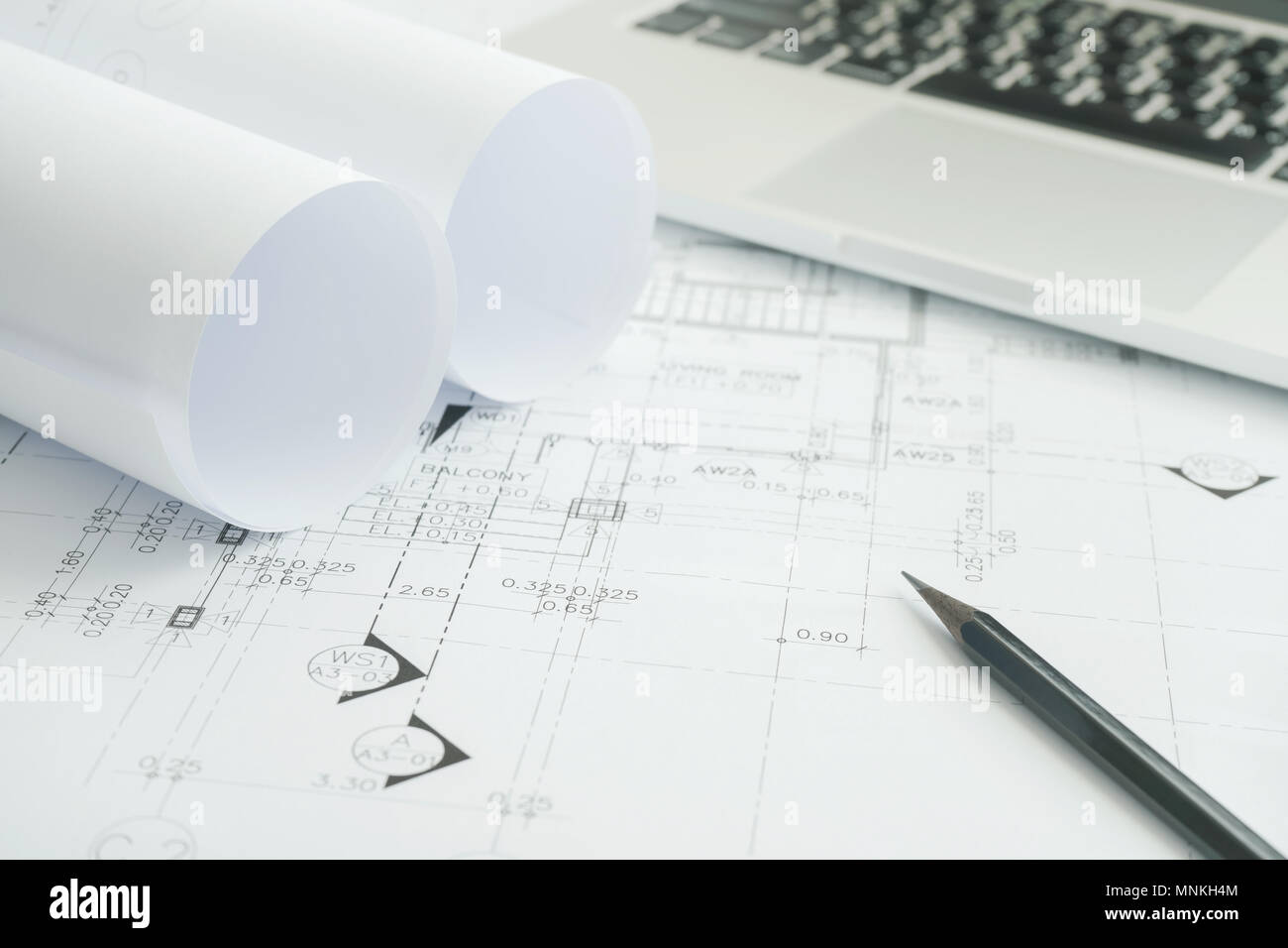 black pencil and computer laptop on architectural drawing paper for ...
