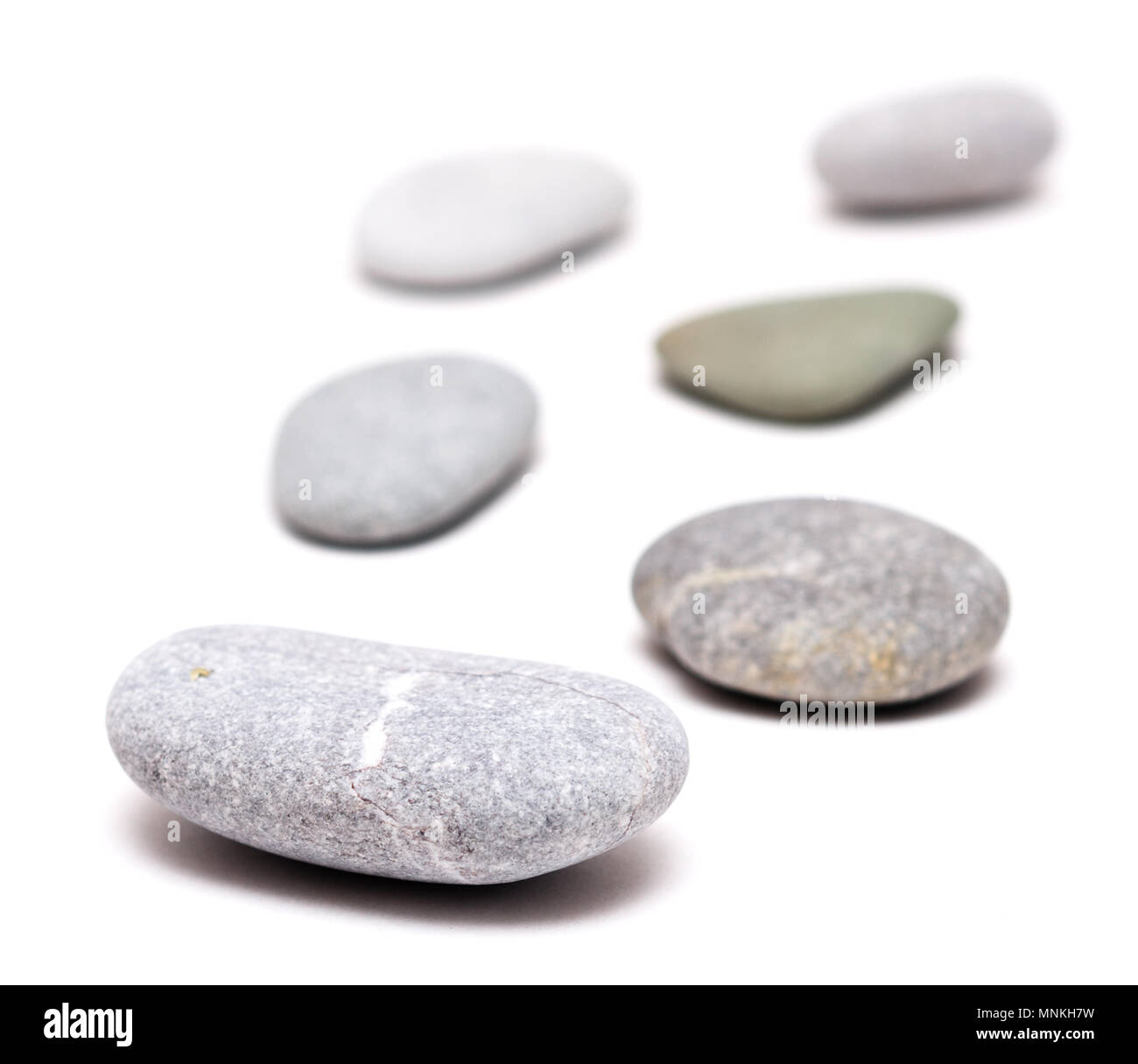Pebbles on white Stock Photo - Alamy