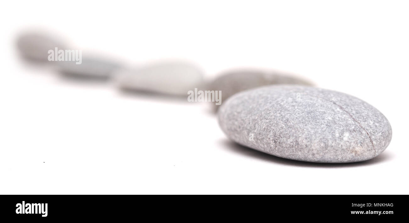Pebbles on white Stock Photo - Alamy
