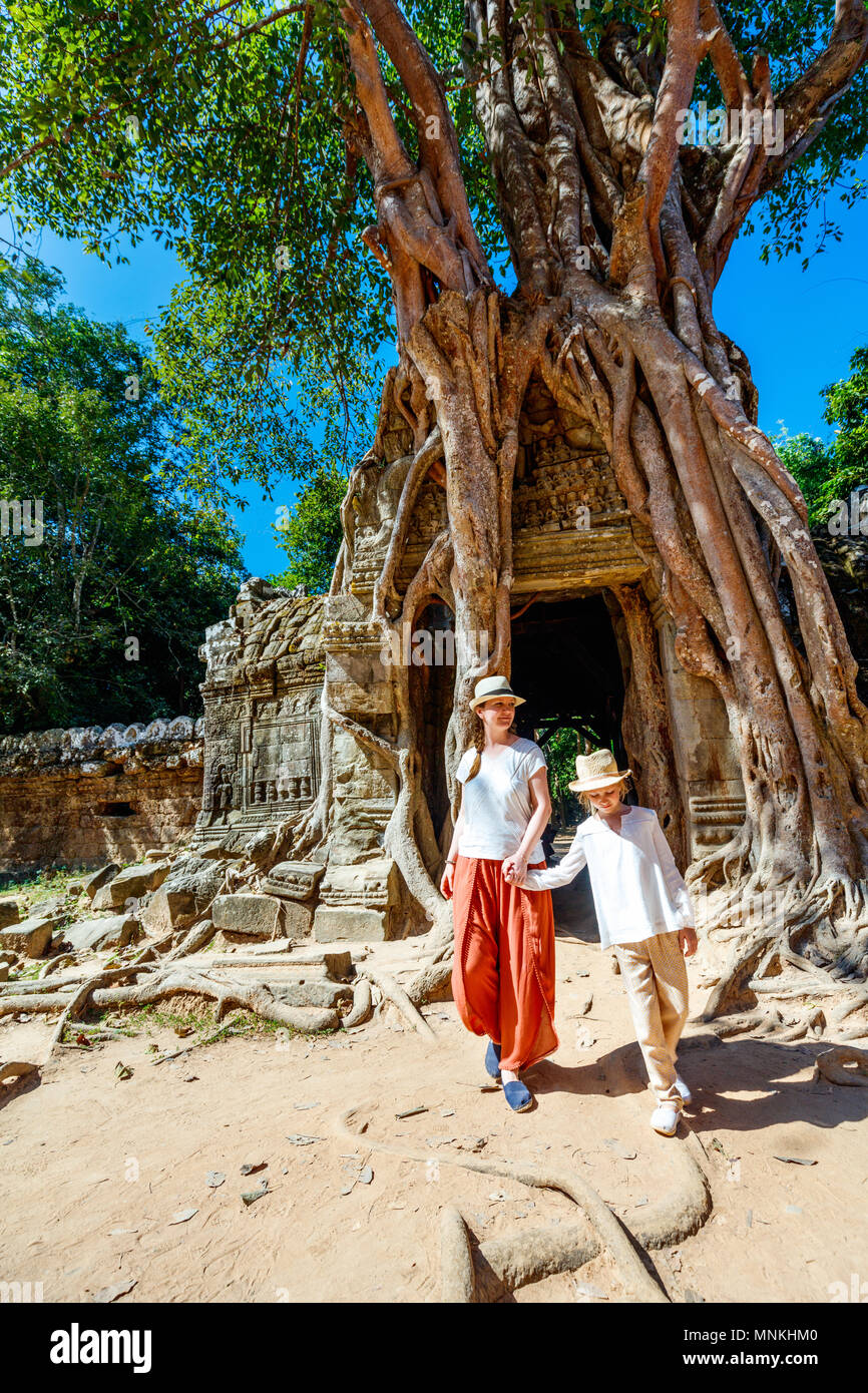 Family visiting ancient Ta Som temple in Angkor Archaeological area in ...