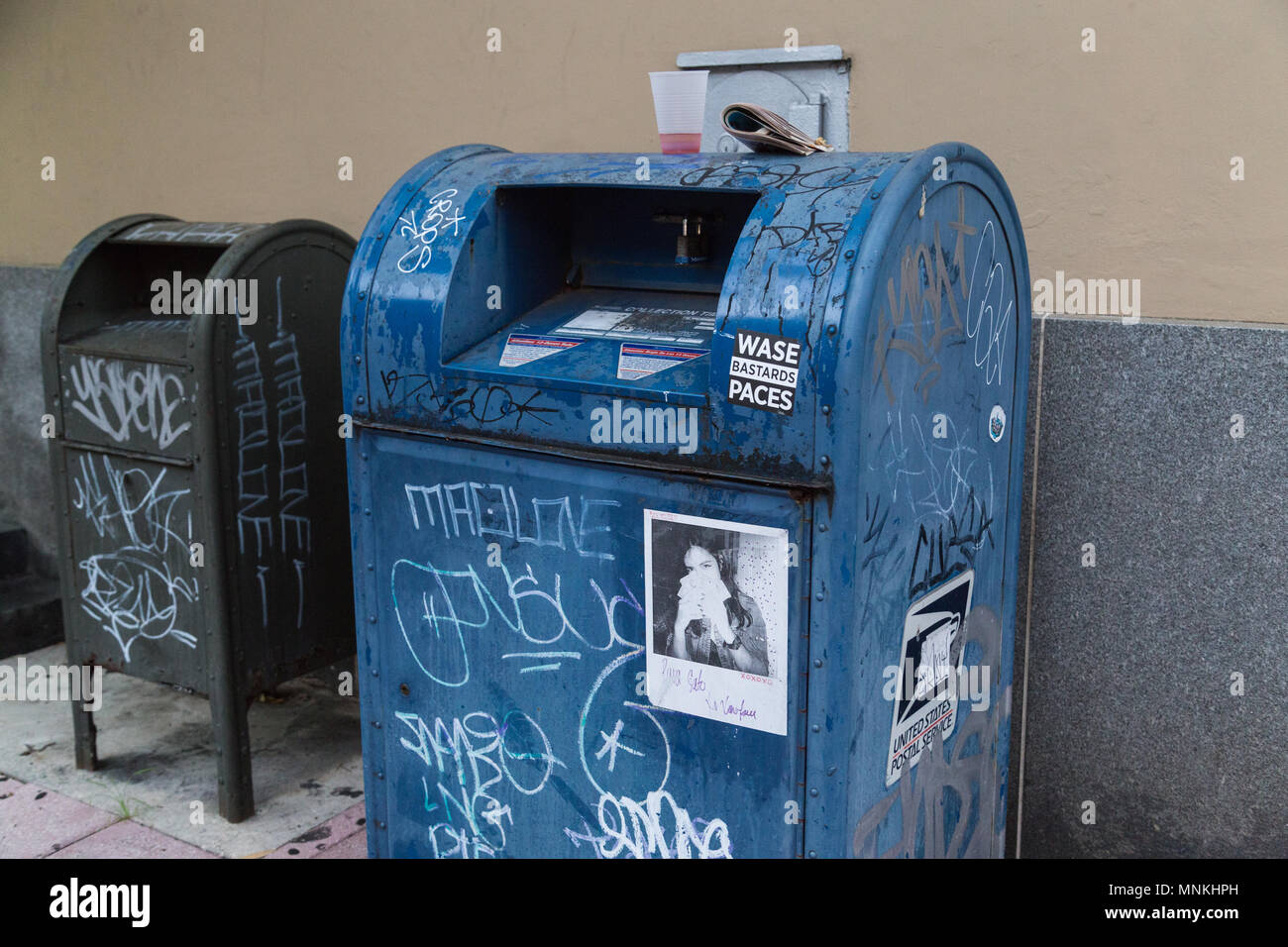 A vandalized US Postal Service mail box in the sidewalk, San Juan ...