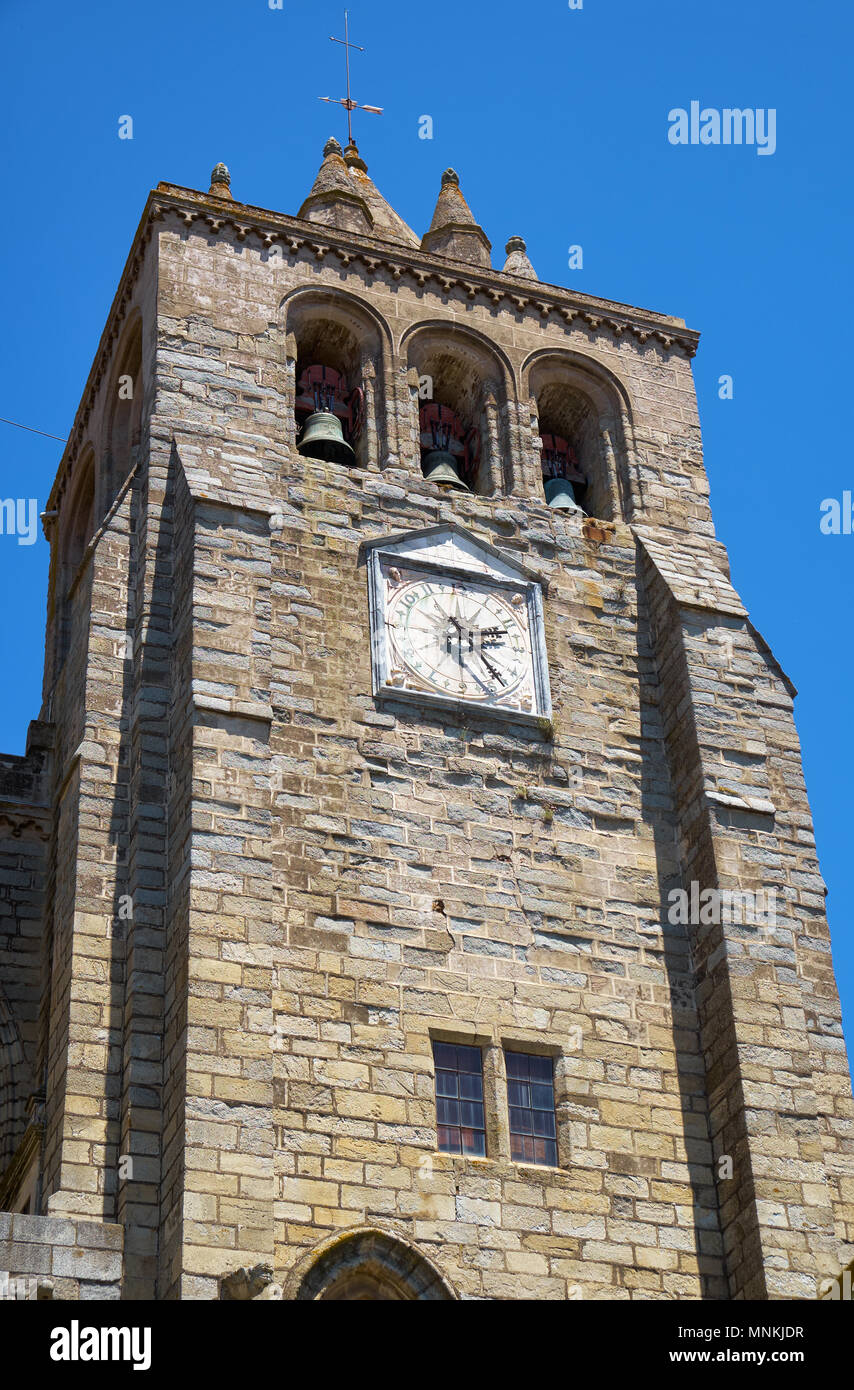 One of the two massive Gothic tower with bells and a clock flanking the ...