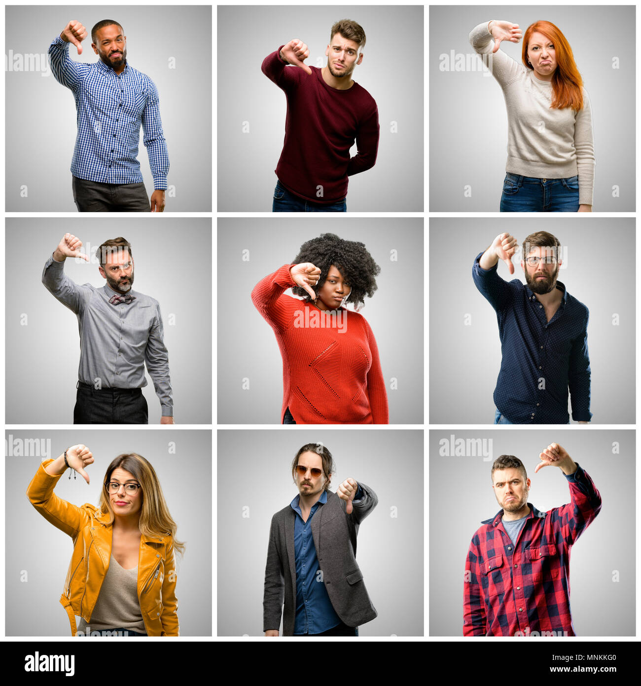 Group of mixed people, women and men showing thumbs down unhappy sign ...