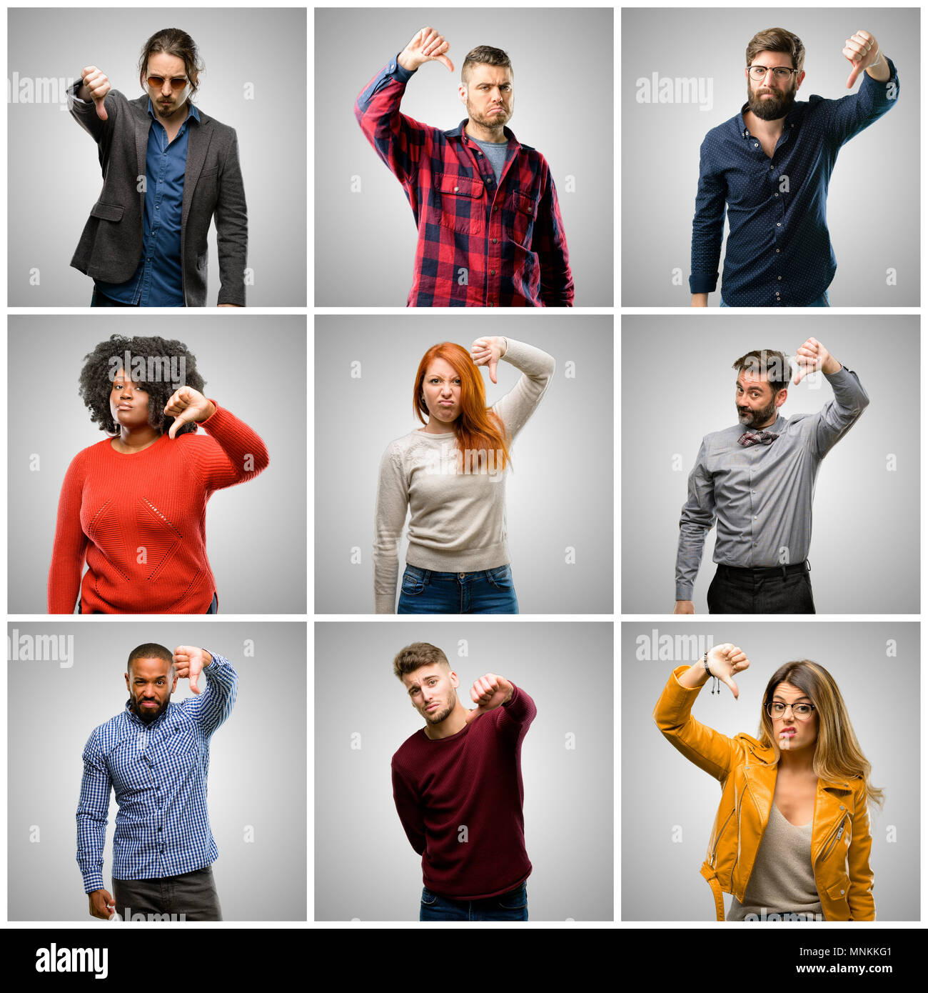 Group of mixed people, women and men showing thumbs down unhappy sign ...