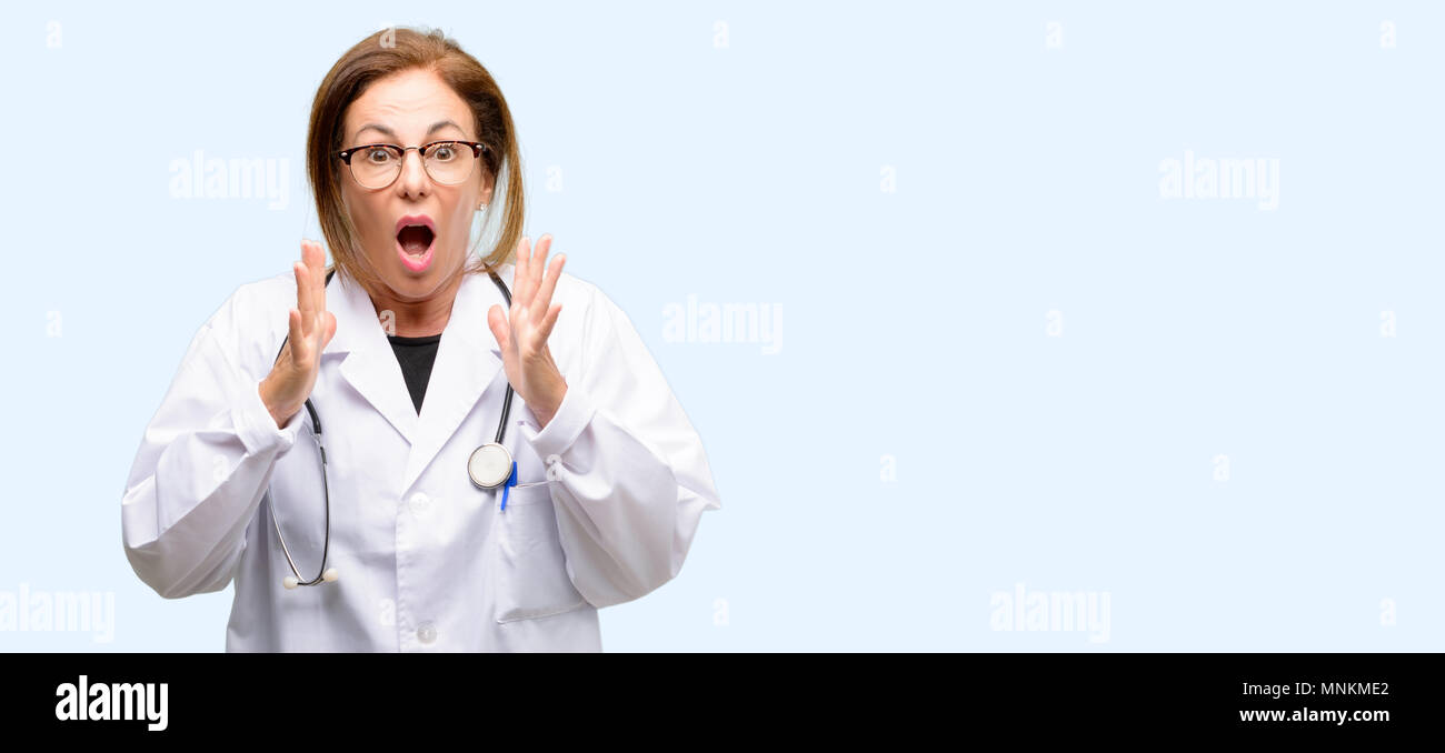 Doctor woman, medical professional stressful keeping hands on head ...