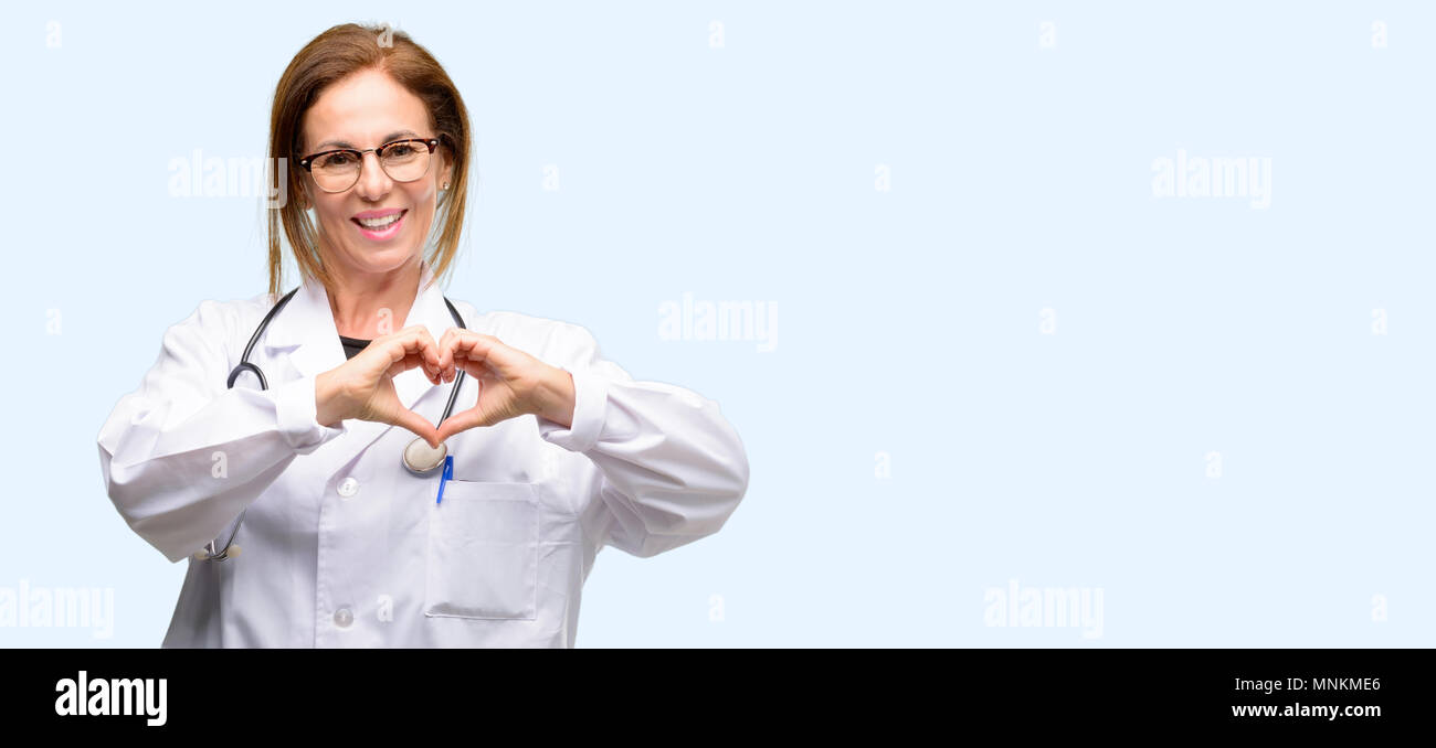 Doctor woman, medical professional happy showing love with hands in ...