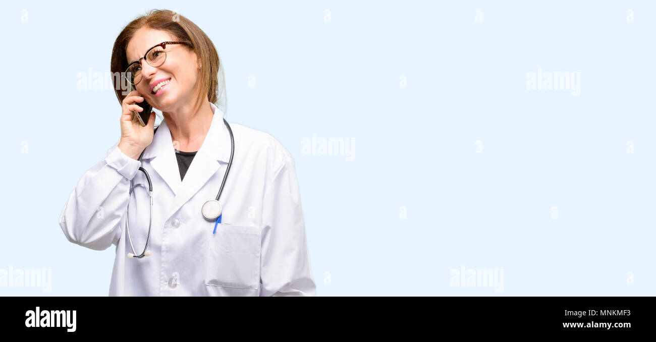 Doctor woman, medical professional happy talking using a smartphone ...