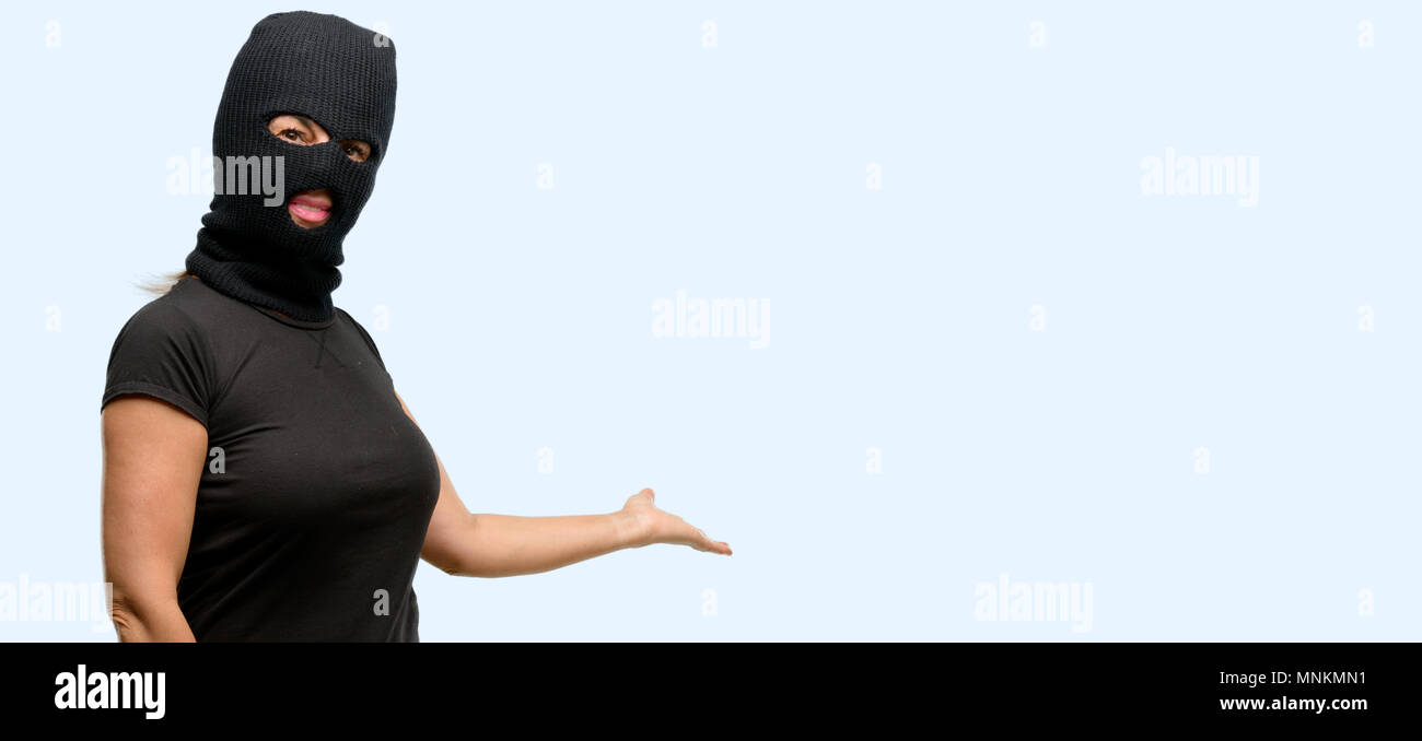 Burglar terrorist woman wearing balaclava ski mask confident and happy ...