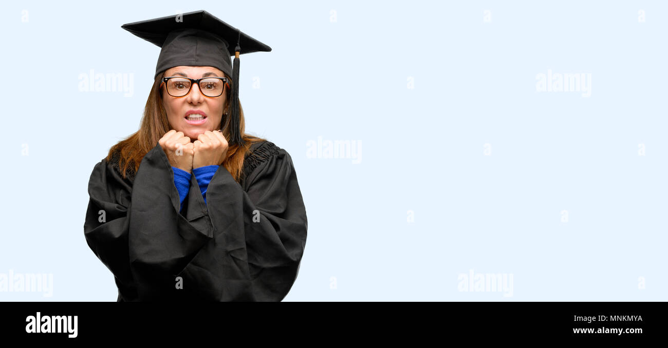 Senior graduate student woman terrified and nervous expressing anxiety ...