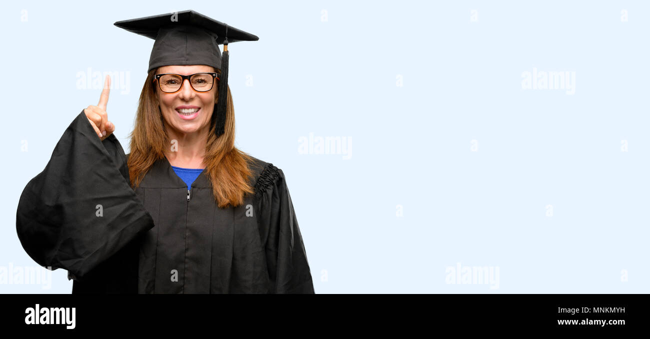Senior graduate student woman raising finger, the number one isolated ...