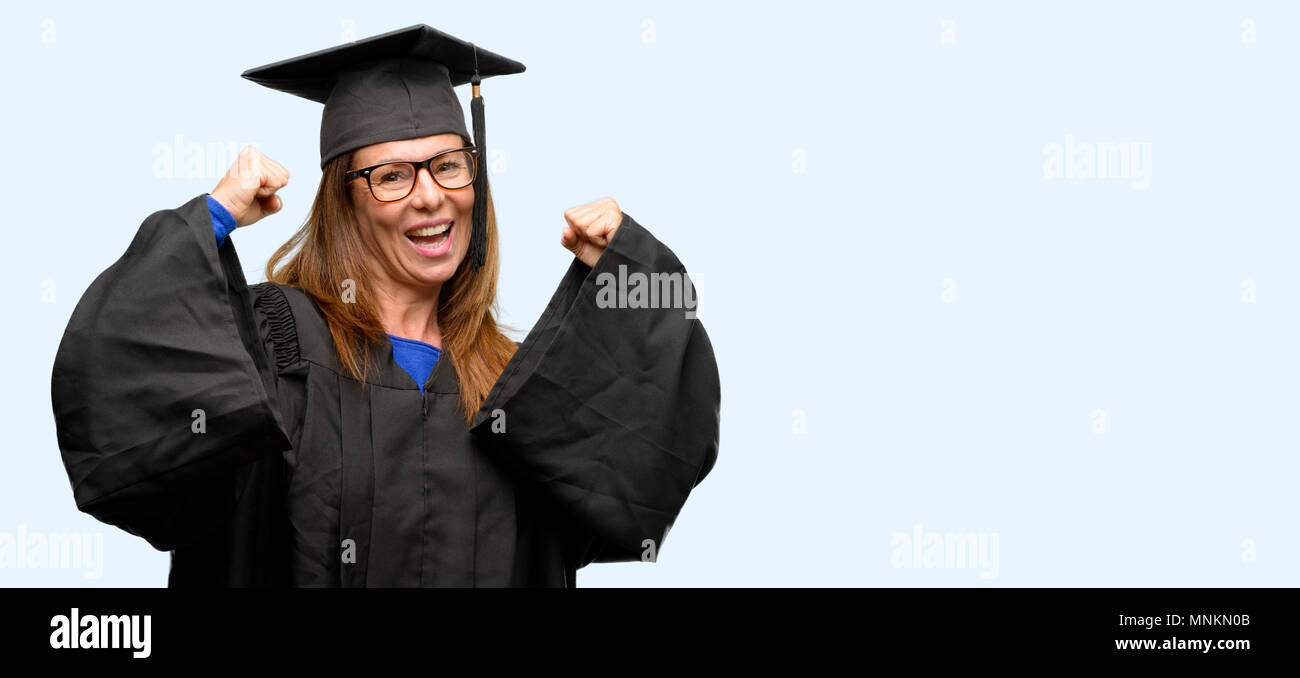 Senior graduate student woman happy and excited celebrating victory ...