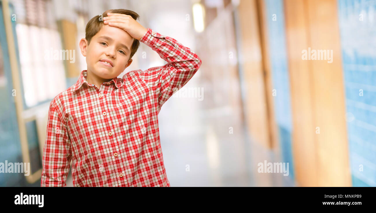 Handsome toddler child with green eyes terrified and nervous expressing ...