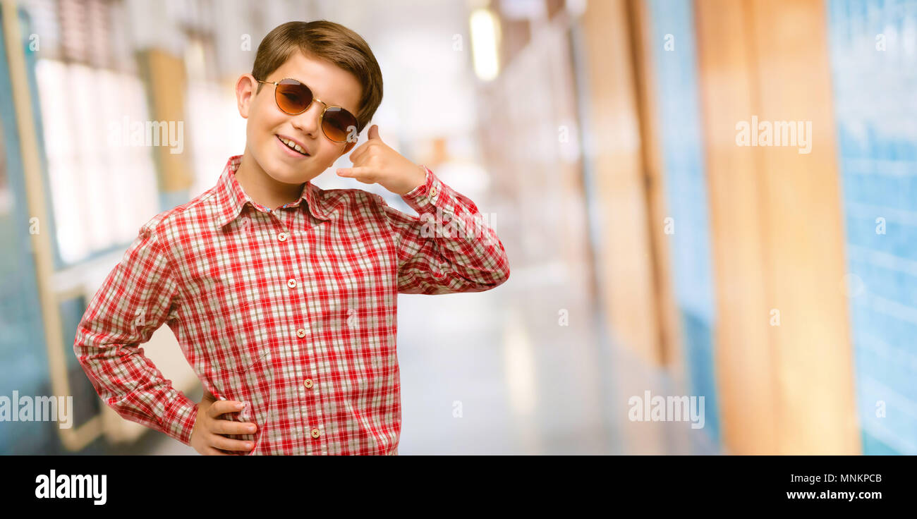 Handsome toddler child with green eyes happy and excited making showing ...