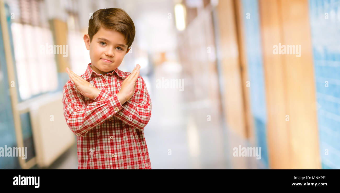 Handsome toddler child with green eyes annoyed with bad attitude making ...