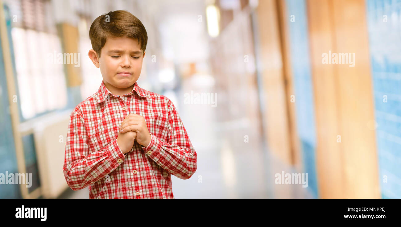 Handsome toddler child with green eyes crying depressed full of sadness ...