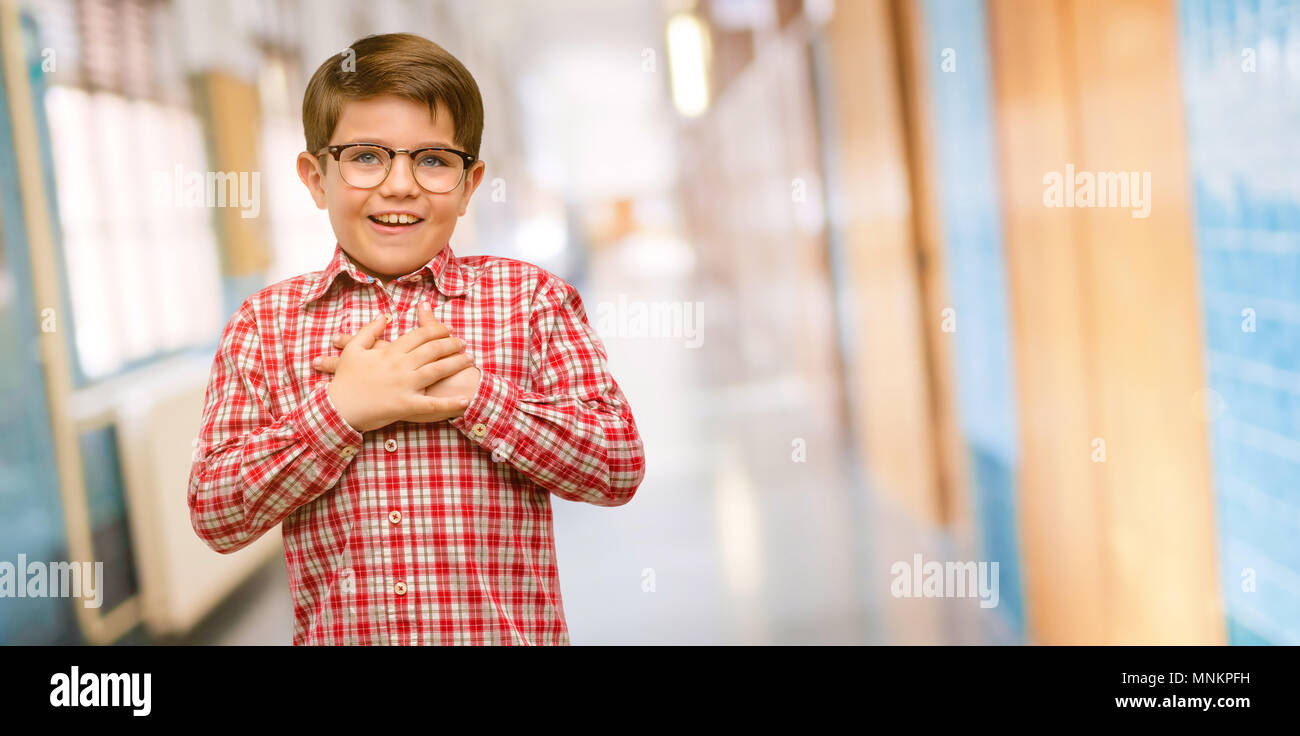 Handsome toddler child with green eyes having charming smile holding ...