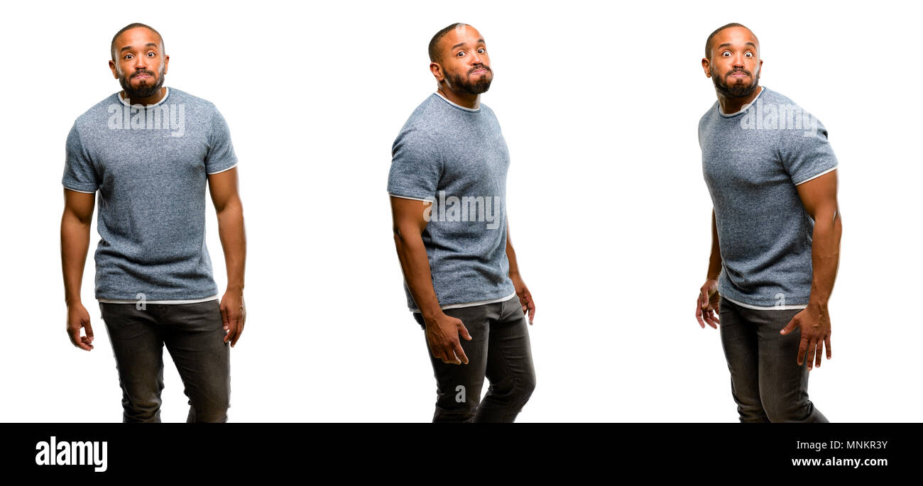 African american man with beard puffing out cheeks, having fun making ...