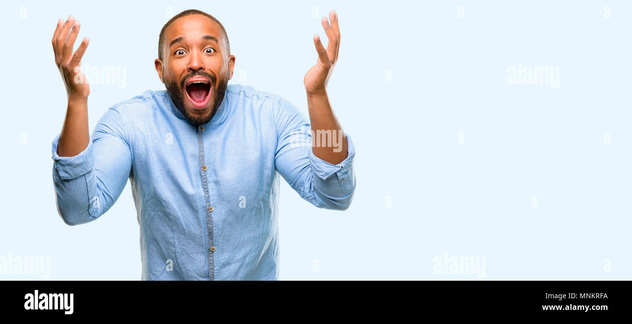 African american man with beard scared in shock, expressing panic and ...