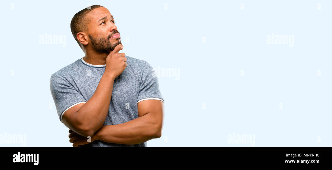 African american man with beard thinking and looking up expressing ...