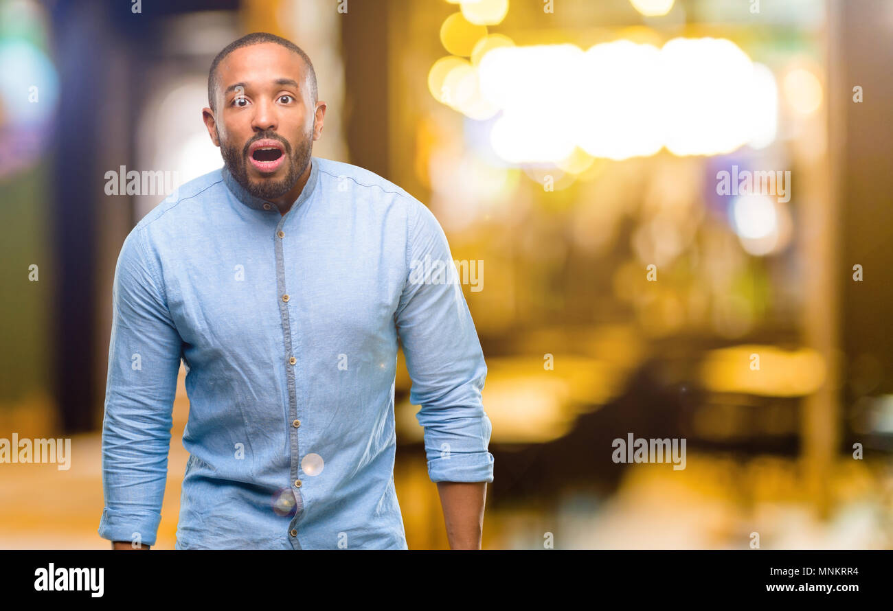 African american man with beard scared in shock, expressing panic and ...