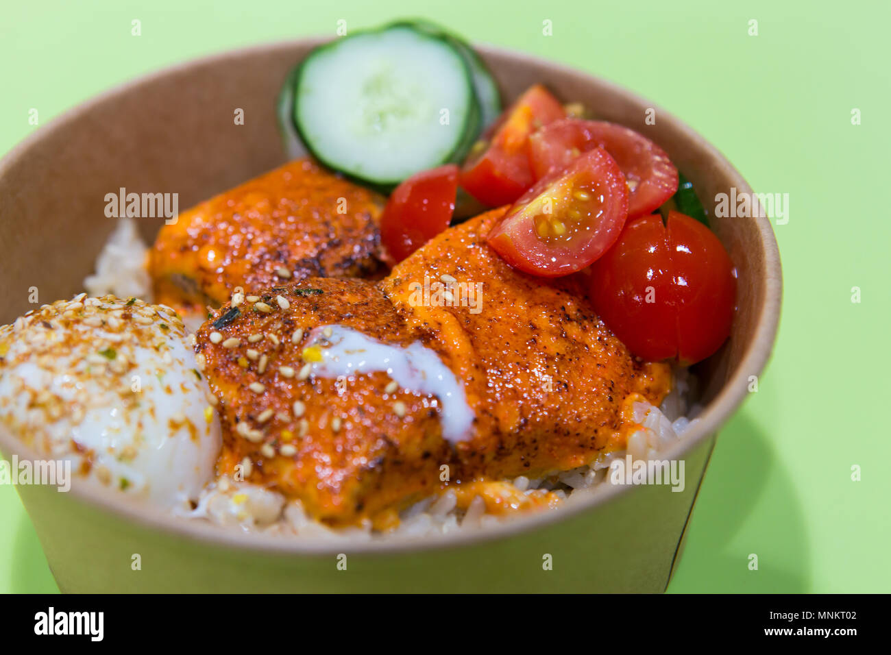 Delicious Japanese food in paper bowl put on a green table surface at ...