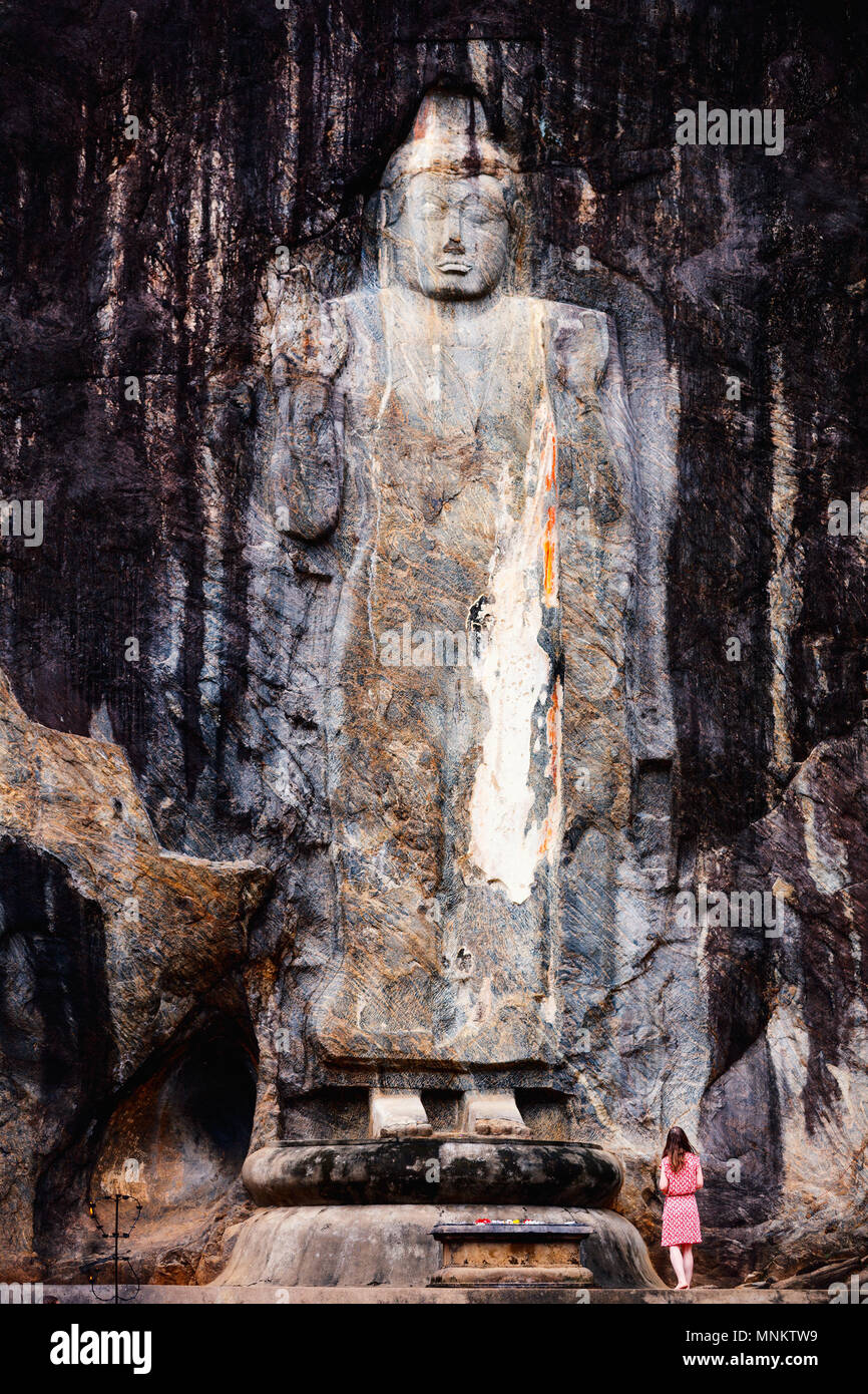 Female tourist visiting Buduruwagala temple with well preserved ...
