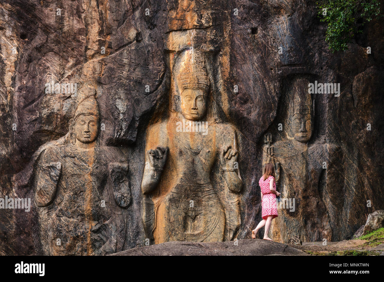 Female tourist visiting Buduruwagala temple with well preserved ...