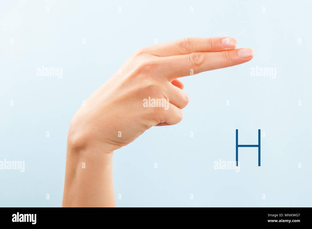 American sign language. Female hand showing letter H isolated on blue ...
