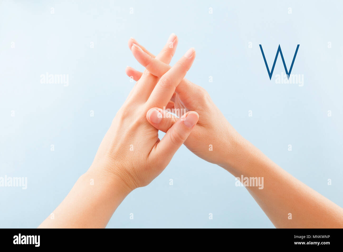 Fingerspelling alphabet. Female hands isolated on blue background ...