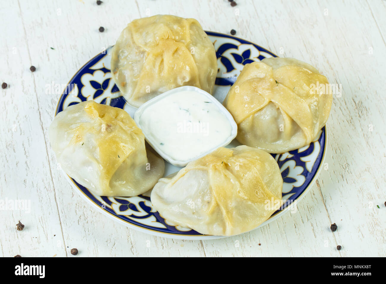 Manti - asian dumplings with sauce Stock Photo - Alamy