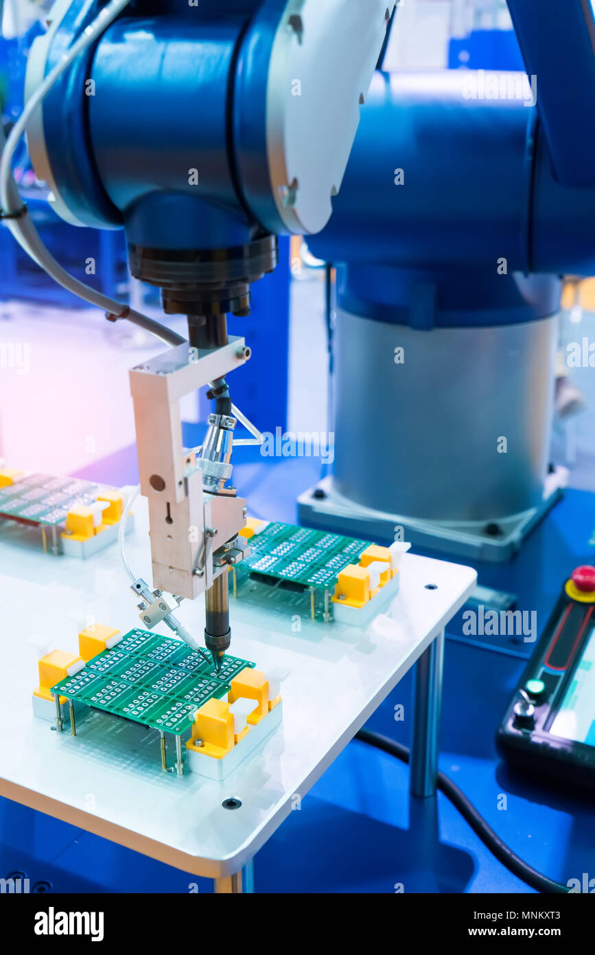 robot machine tool at printed circuit boards industrial manufacture ...